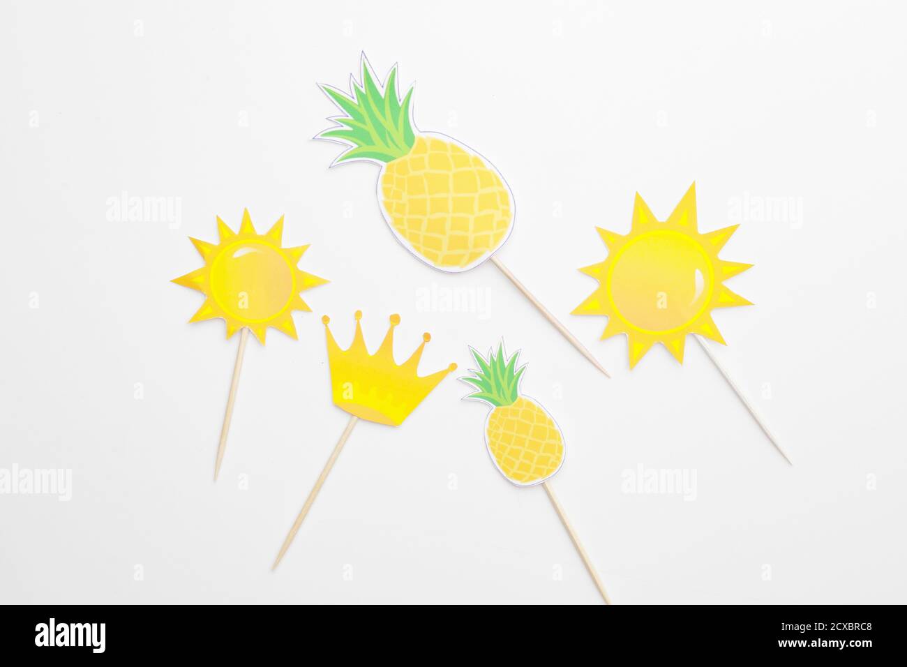 Stylish cupcake toppers on white background Stock Photo - Alamy