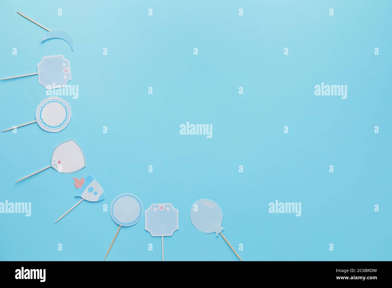 Stylish cupcake toppers on color background Stock Photo - Alamy