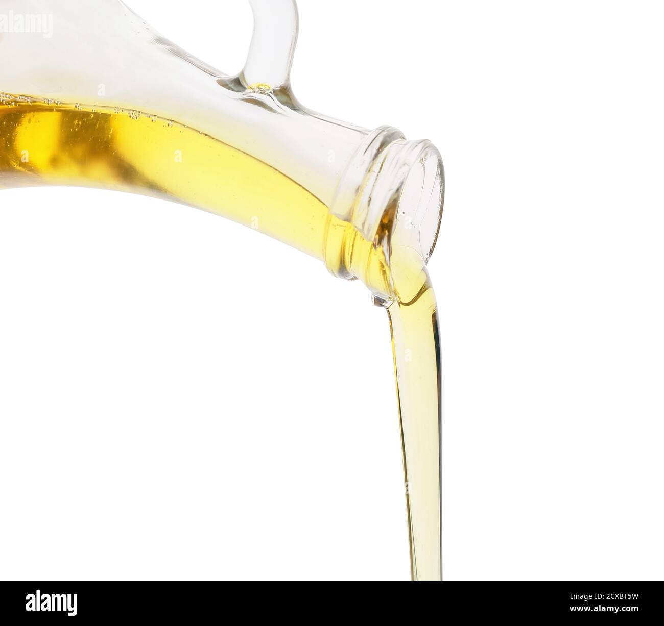 Pouring of fresh olive oil from bottle on white background Stock Photo ...