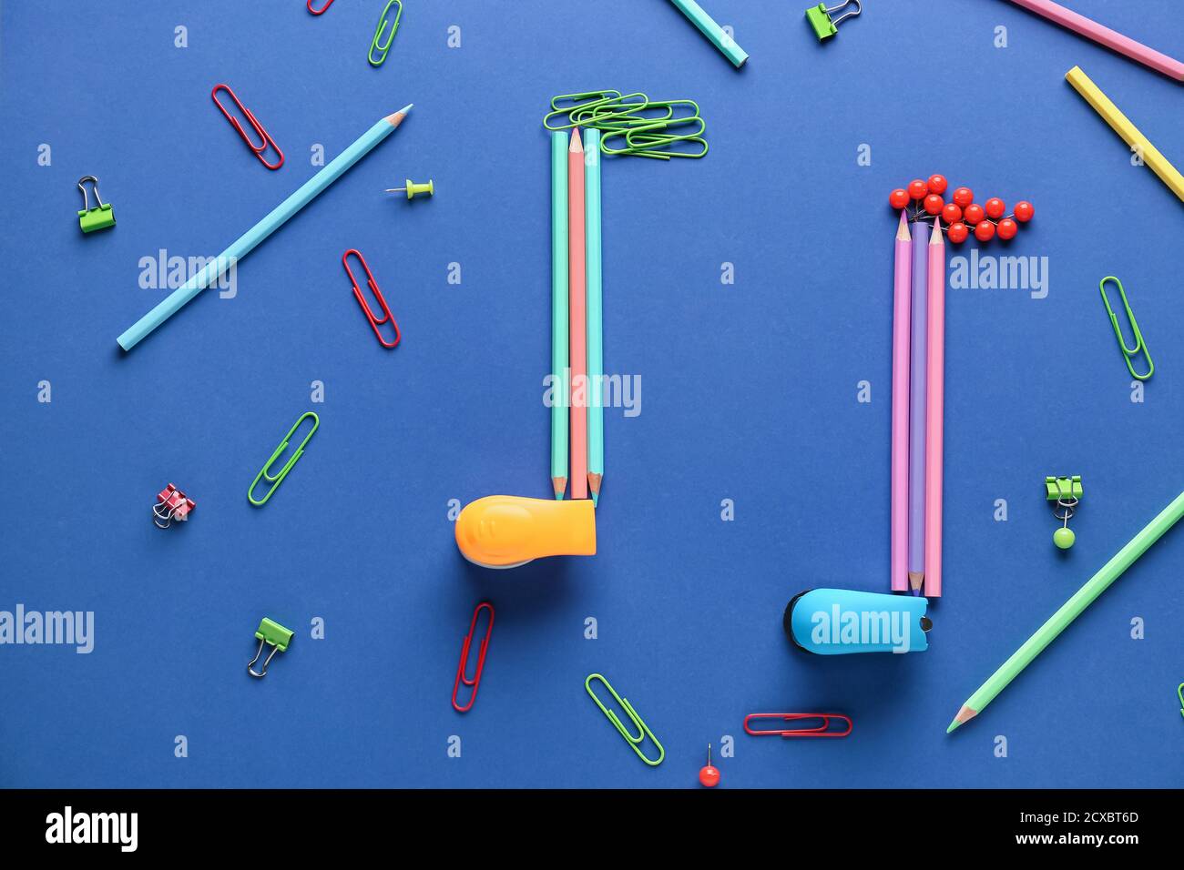 Music notes made of stationery on color background Stock Photo - Alamy