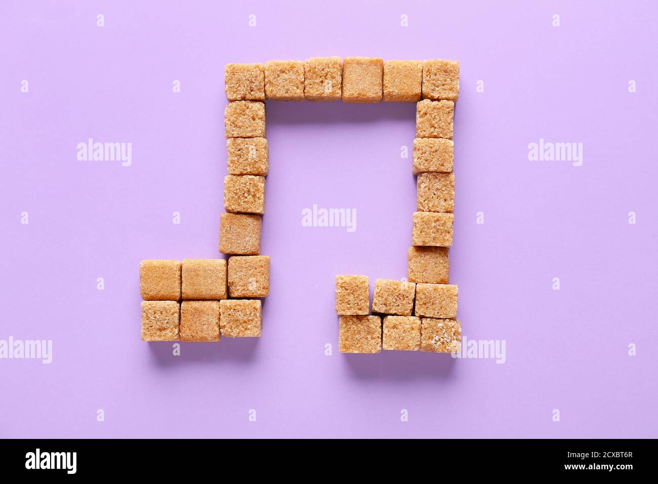 Music note made of sugar on color background Stock Photo - Alamy