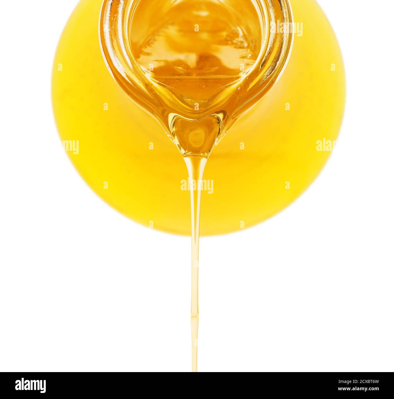 Pouring of fresh olive oil from bottle on white background Stock Photo ...