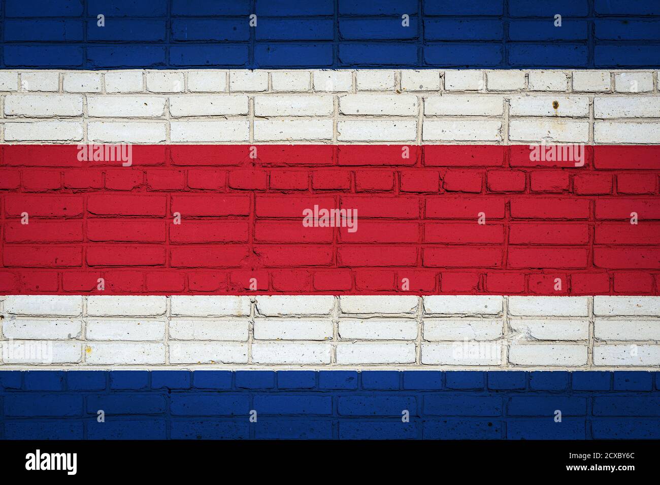 National flag of Costa Rica depicting in paint colors on an old brick ...