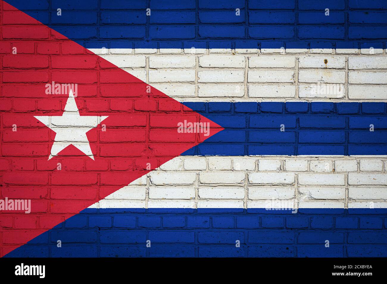 National flag of Cuba depicting in paint colors on an old brick wall ...