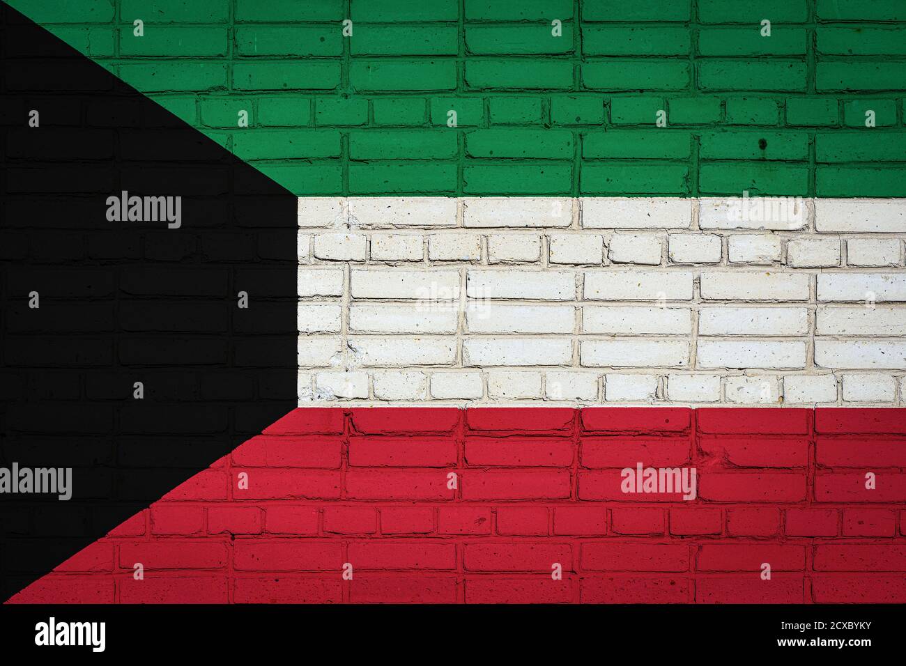 National flag of Kuwait depicting in paint colors on an old brick wall ...