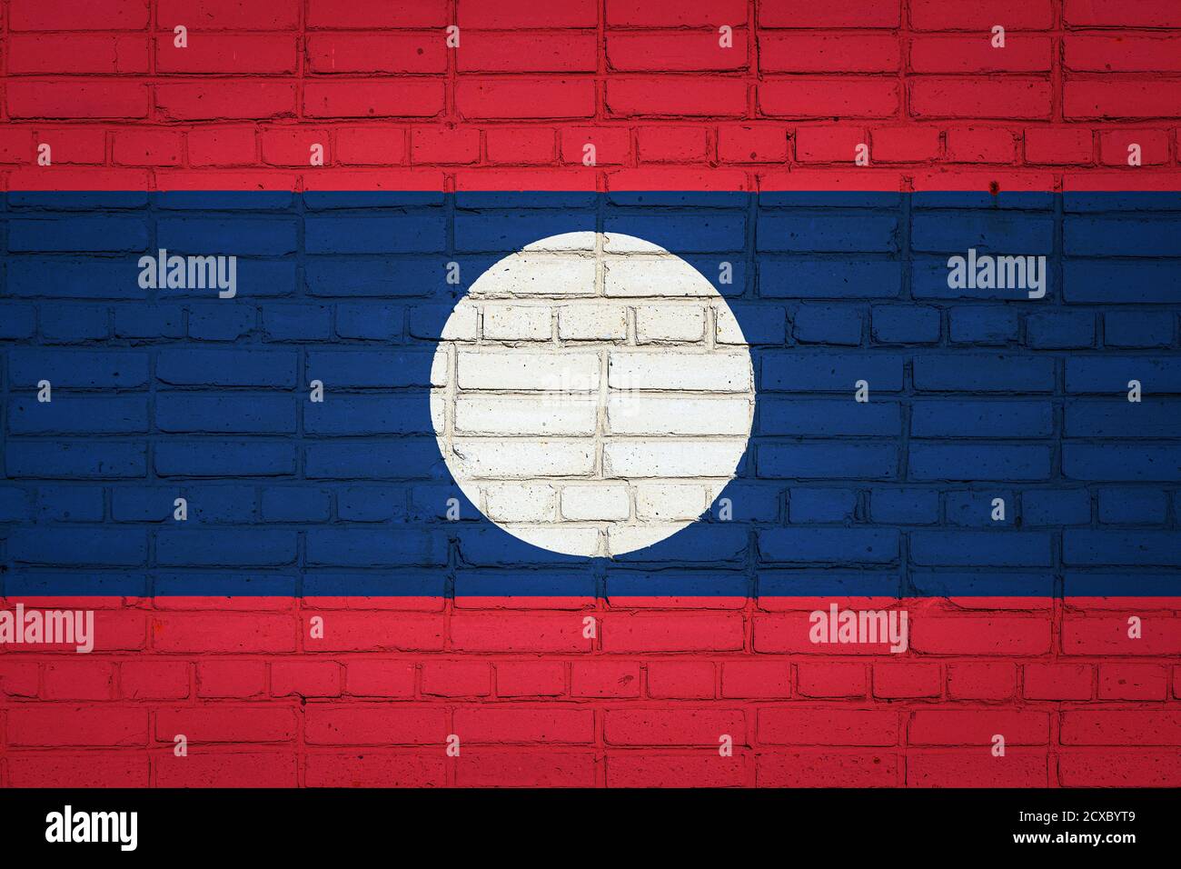 National flag of Laos depicting in paint colors on an old brick wall ...