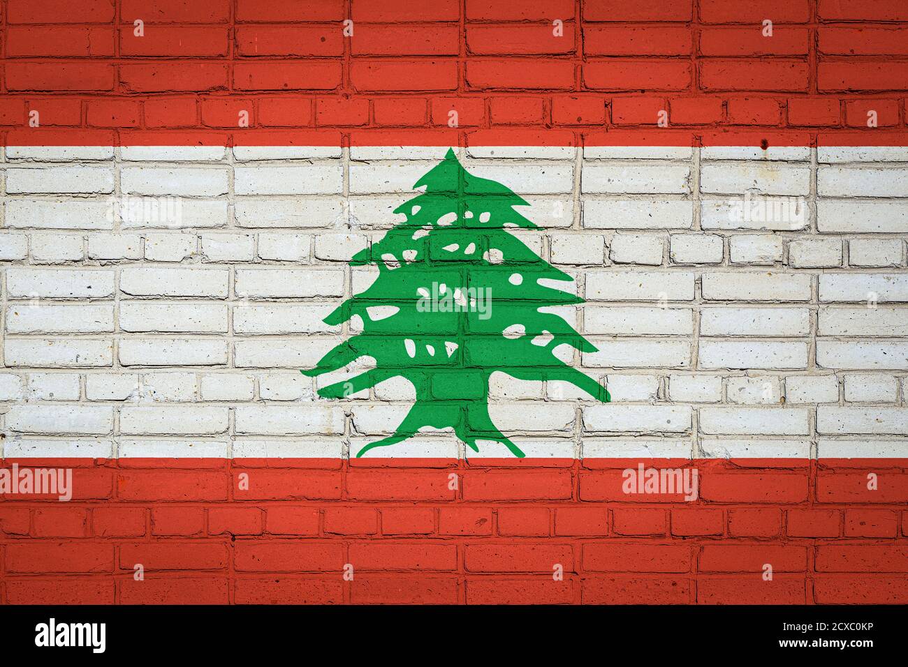 National flag of Lebanon depicting in paint colors on an old brick wall ...