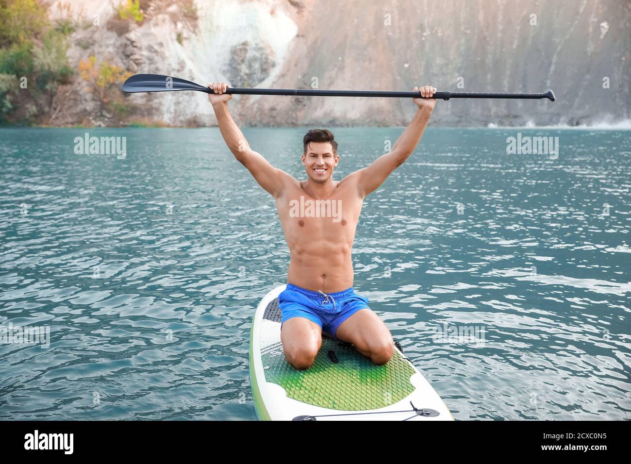 Man paddleboarding mountains hi-res stock photography and images - Alamy