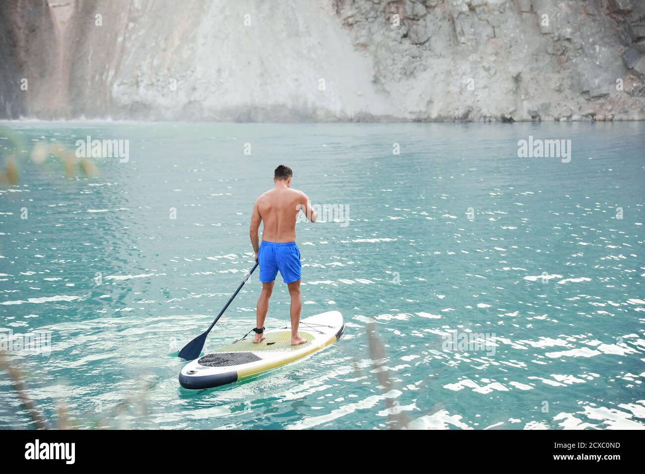 Man paddleboarding mountains hi-res stock photography and images - Alamy