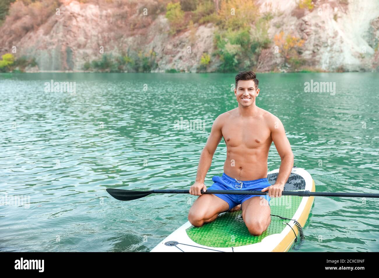 Man paddleboarding mountains hi-res stock photography and images - Alamy