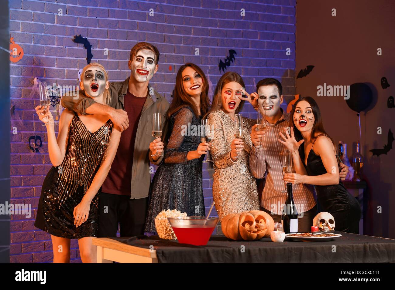 Friends celebrating Halloween at the party Stock Photo - Alamy