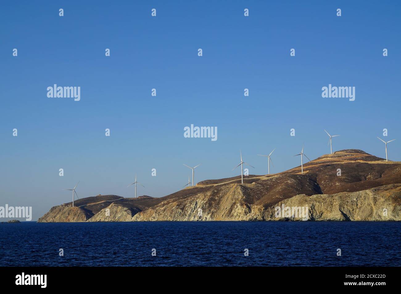 Wind turbines on a barren island in Greece Stock Photo - Alamy