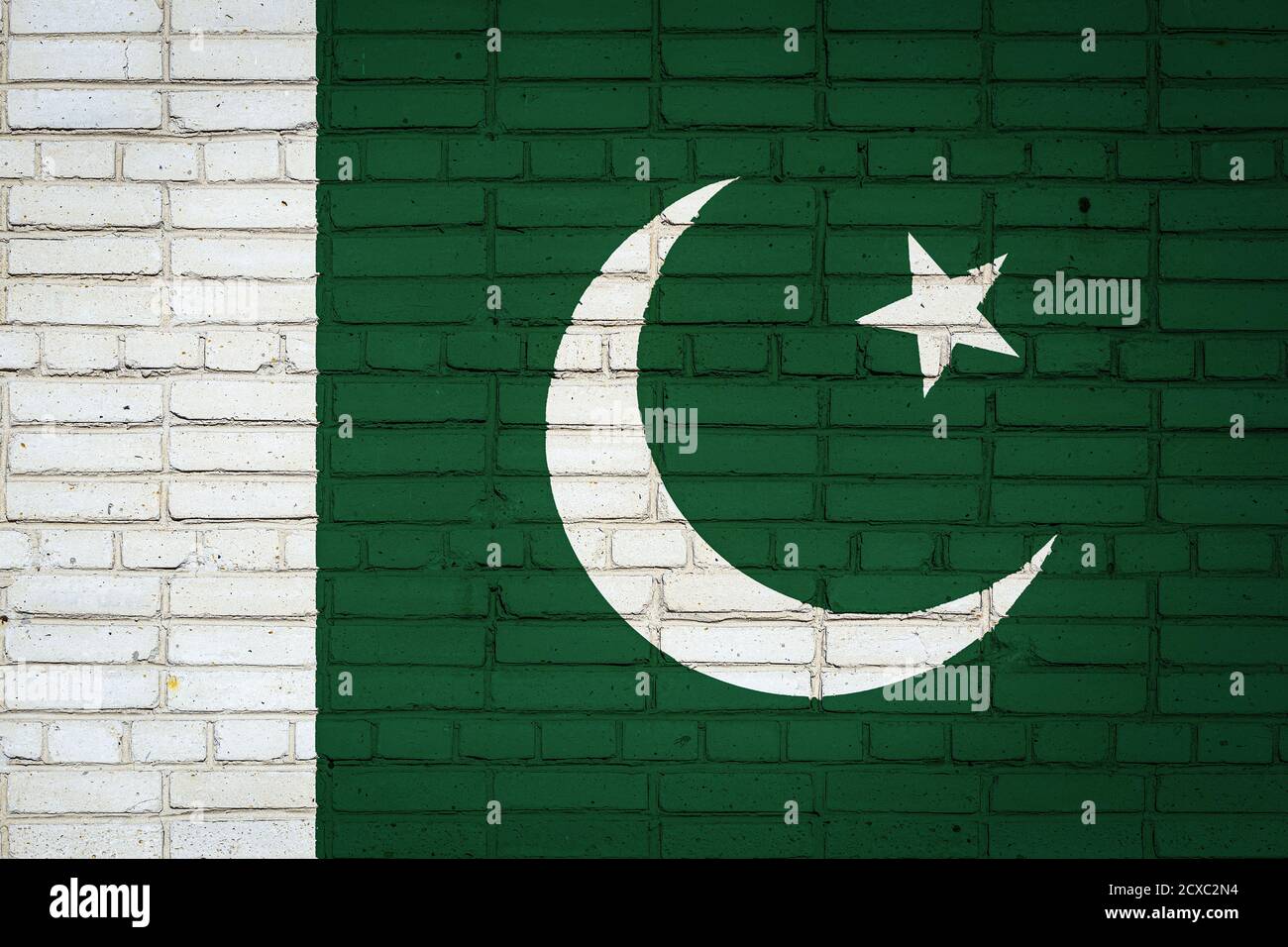 National flag of Pakistan depicting in paint colors on an old brick ...