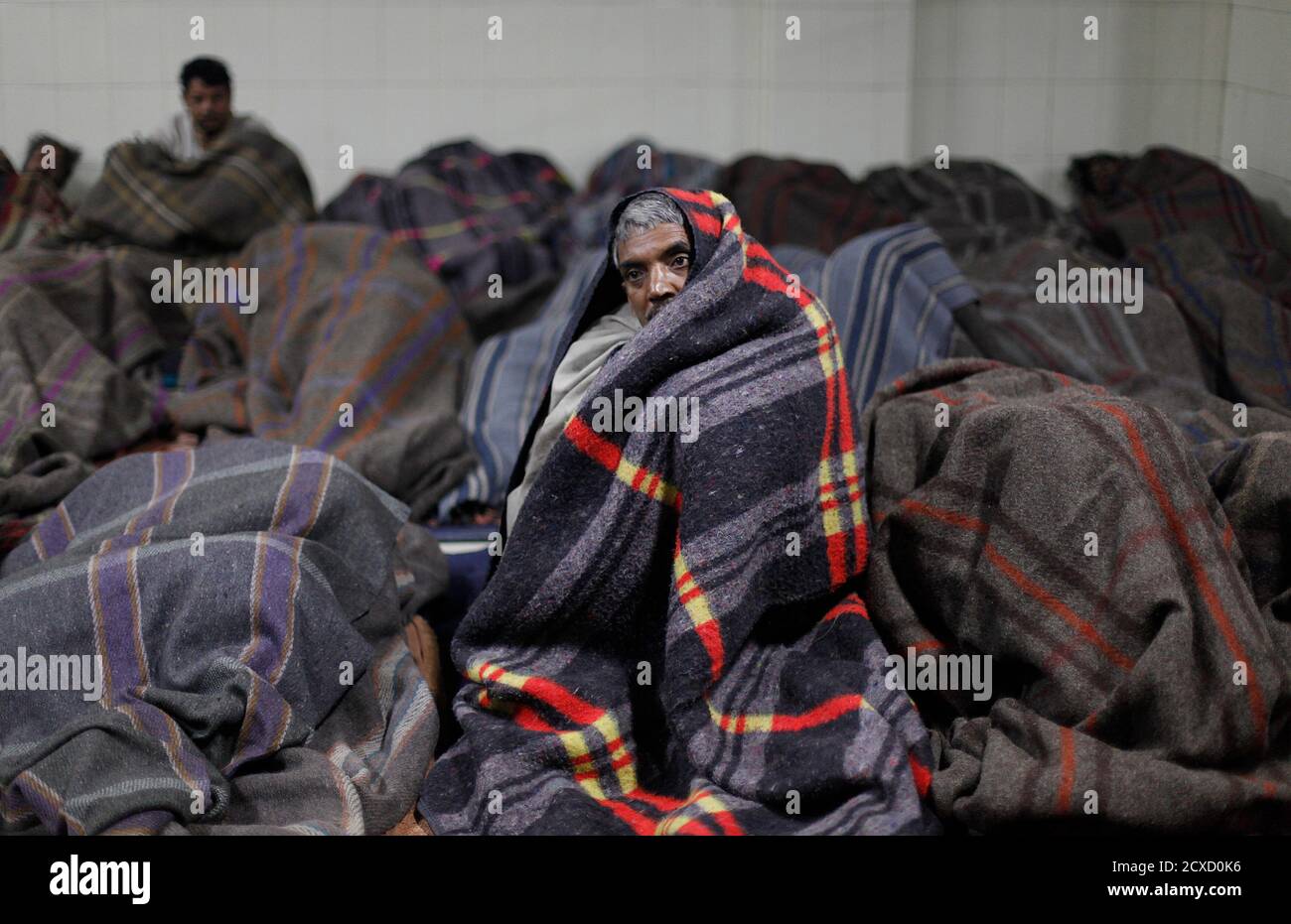Homeless people wrapped in blankets hi-res stock photography and images ...