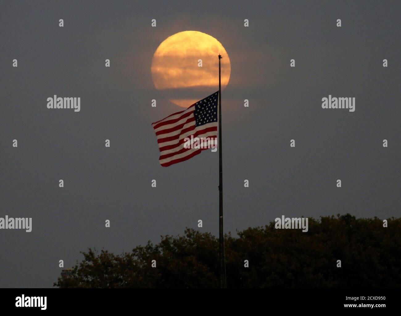 Jersey City, United States. 30th Sep, 2020. A nearly full moon rises ...