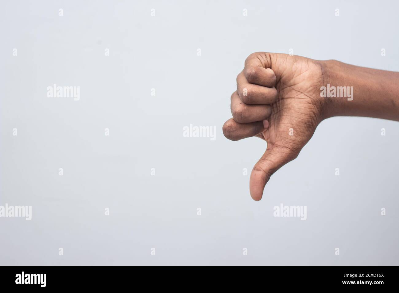 Unlike, dislike, failure gestures concept - Male hand showing dislike ...