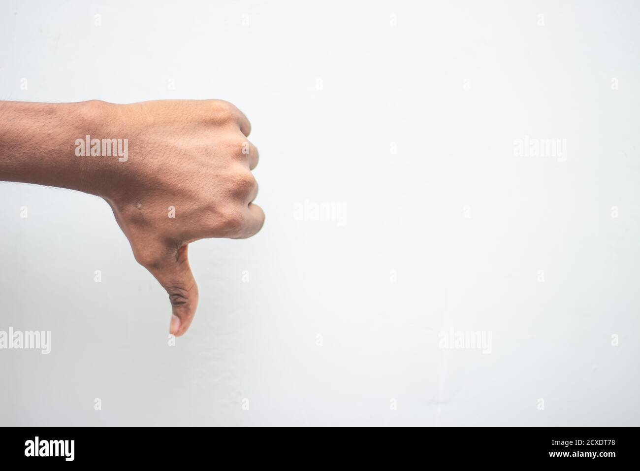 Unlike, dislike, failure gestures concept - Male hand showing dislike ...