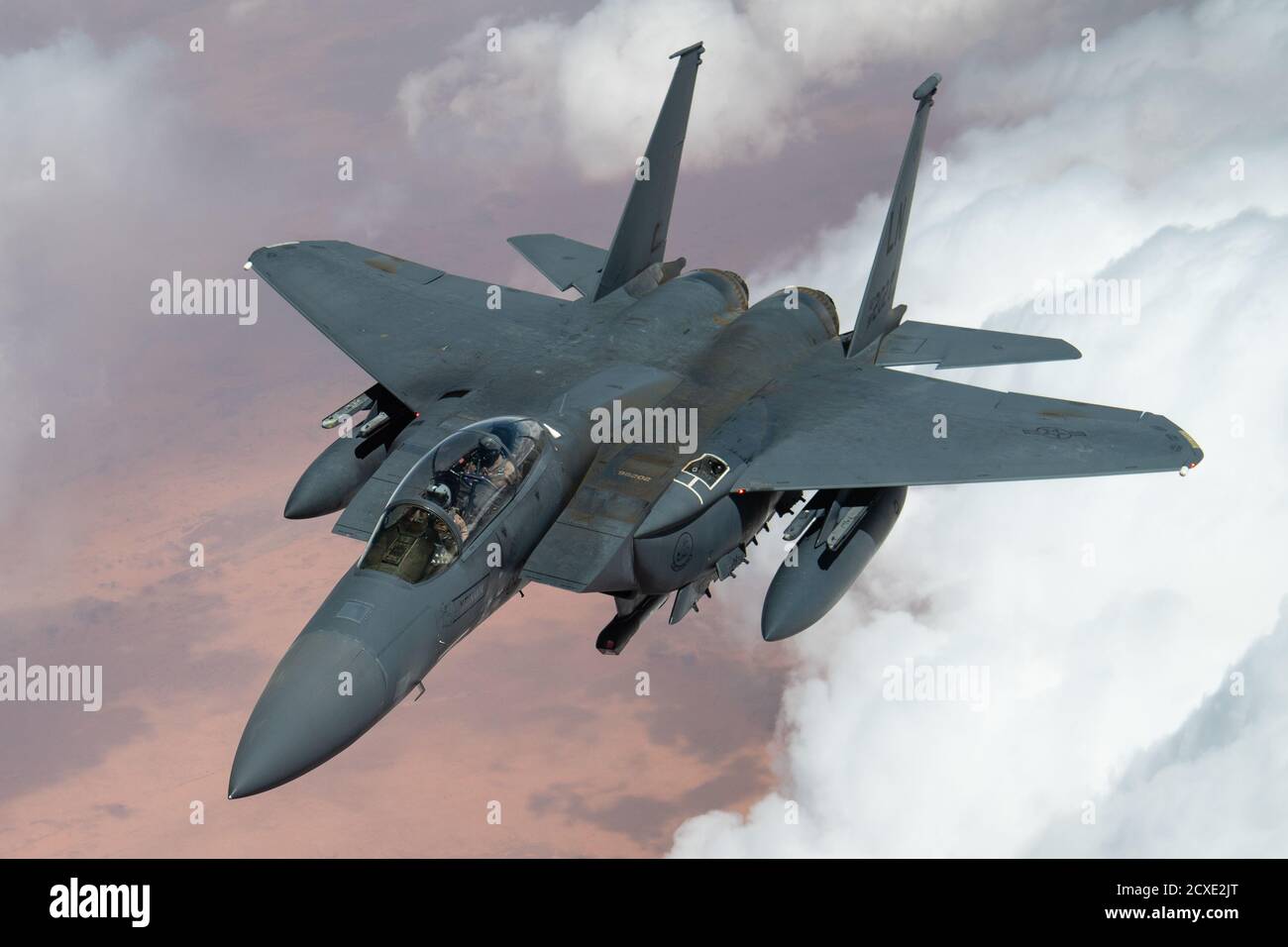 A U.S. Air Force F-15E Strike Eagle flies over the U.S. Central Command ...