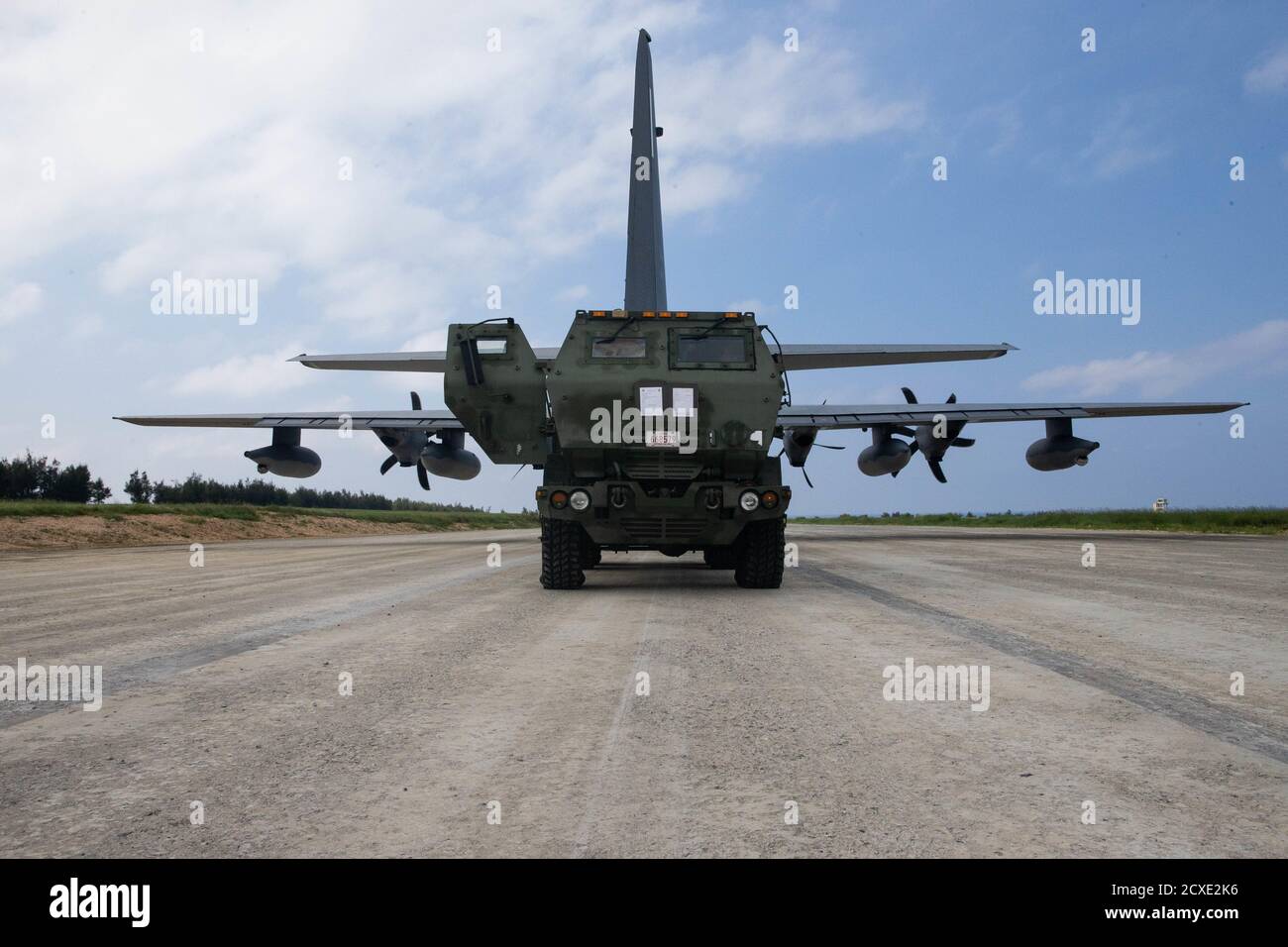 U.S. Marines with 12th Marine Regiment, 3d Marine Division, unload a ...