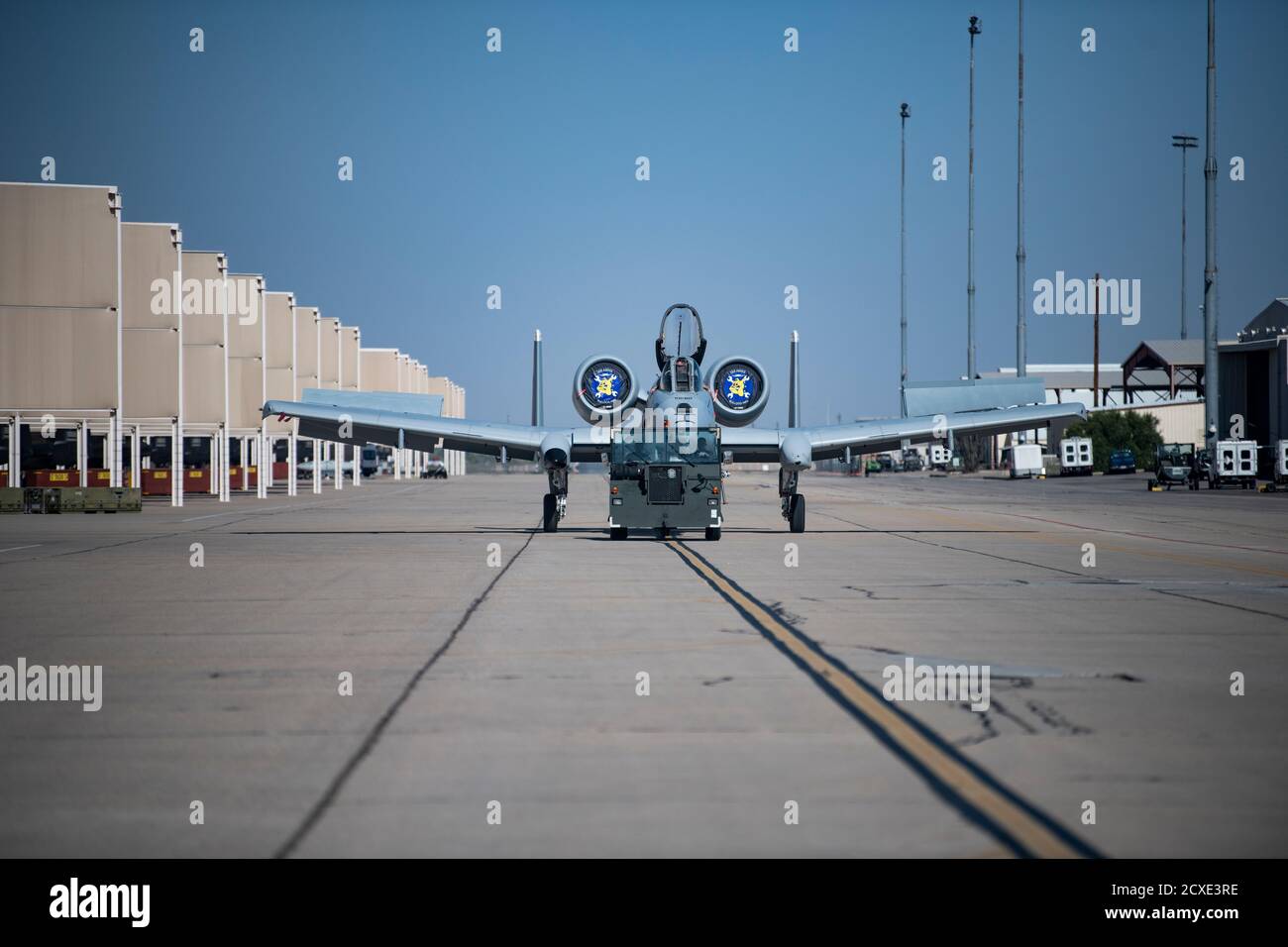 An MB-4 Coleman aircraft tug tractor pulls an A-10C Thunderbolt II ...