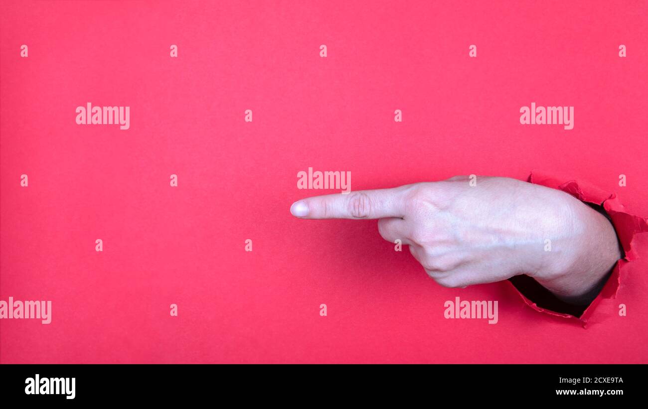 Hand finger pointing on red background. Free space for text and copy ...