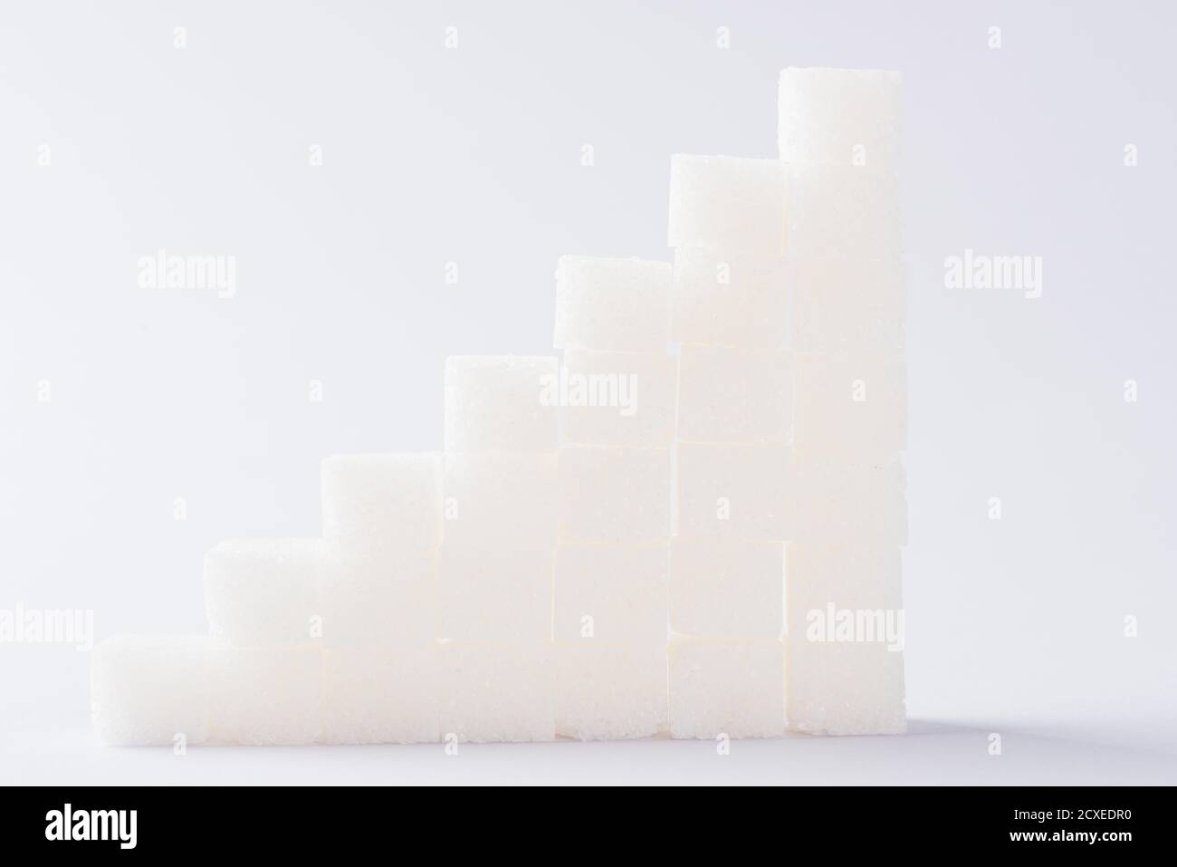 Ascending stacks of sugar cubes graph chart, studio shot isolated on ...