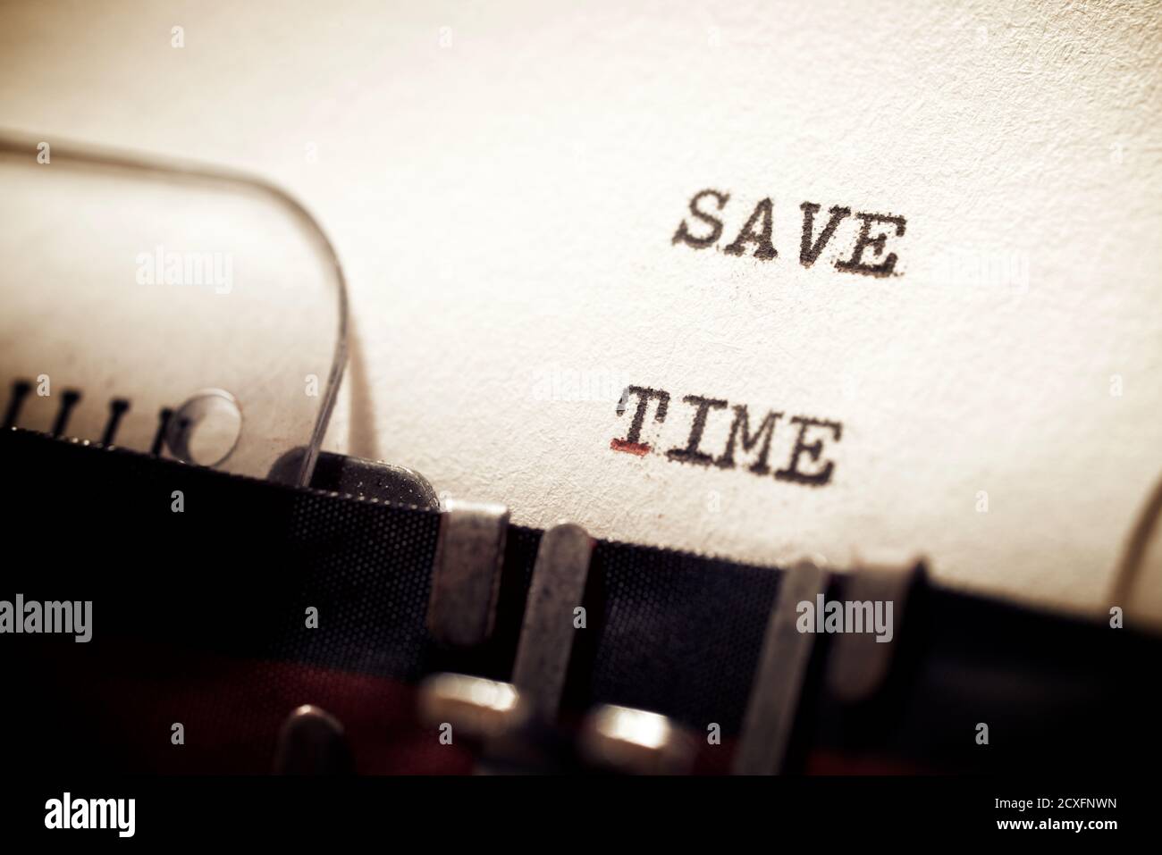 Save time phrase written with a typewriter Stock Photo - Alamy