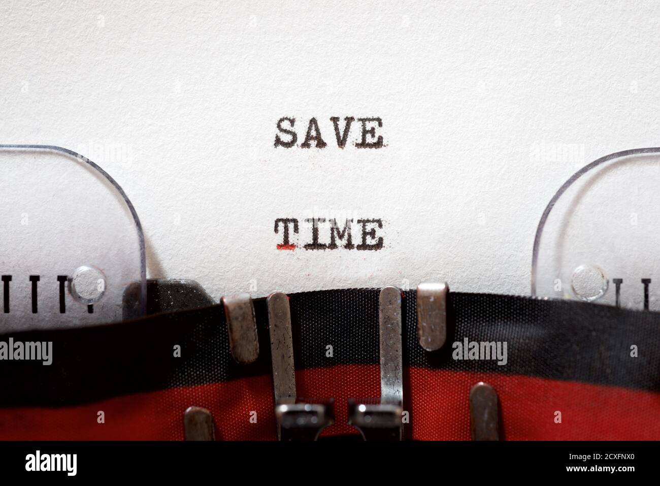 Save time phrase written with a typewriter Stock Photo - Alamy