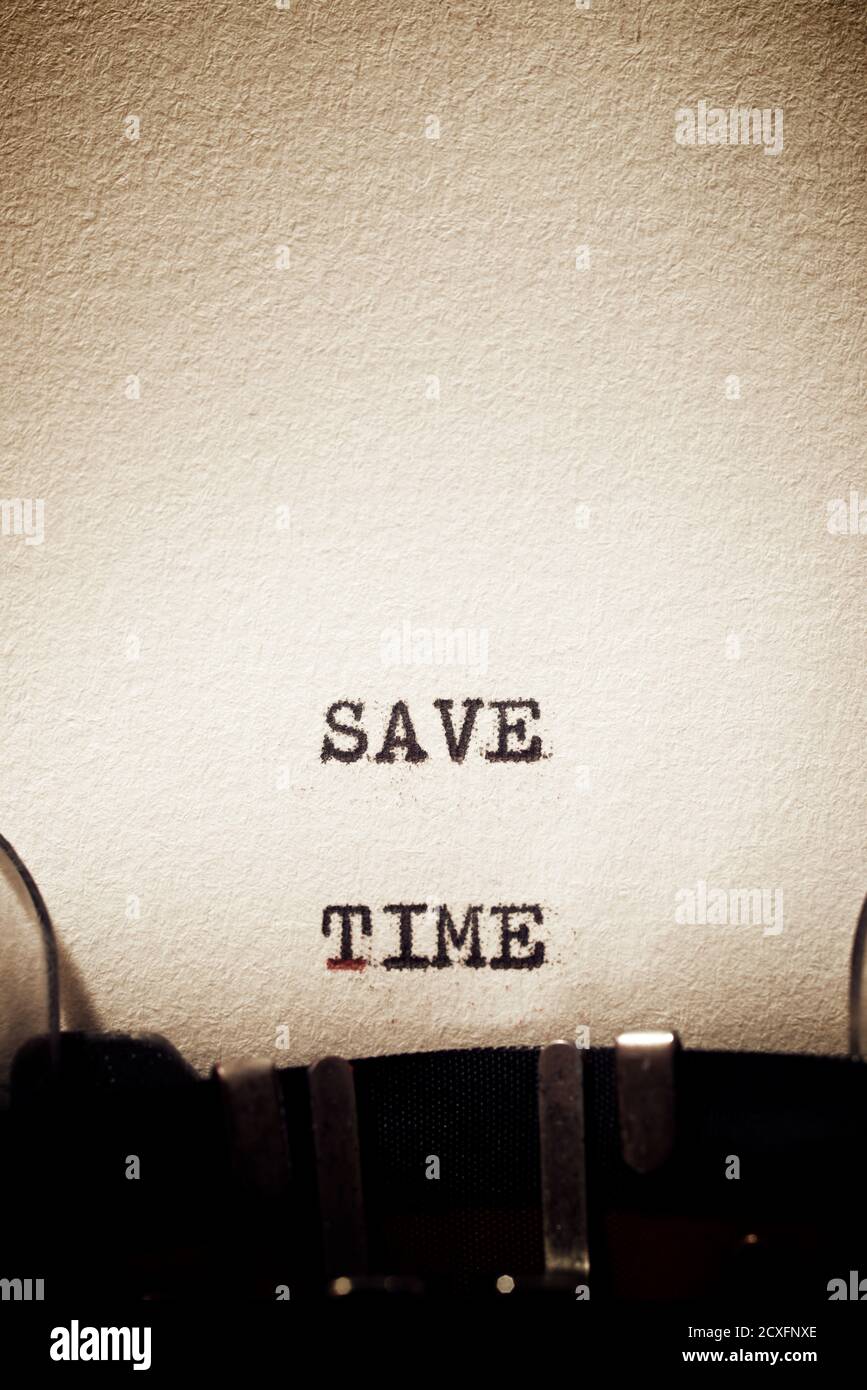 Save time phrase written with a typewriter Stock Photo - Alamy