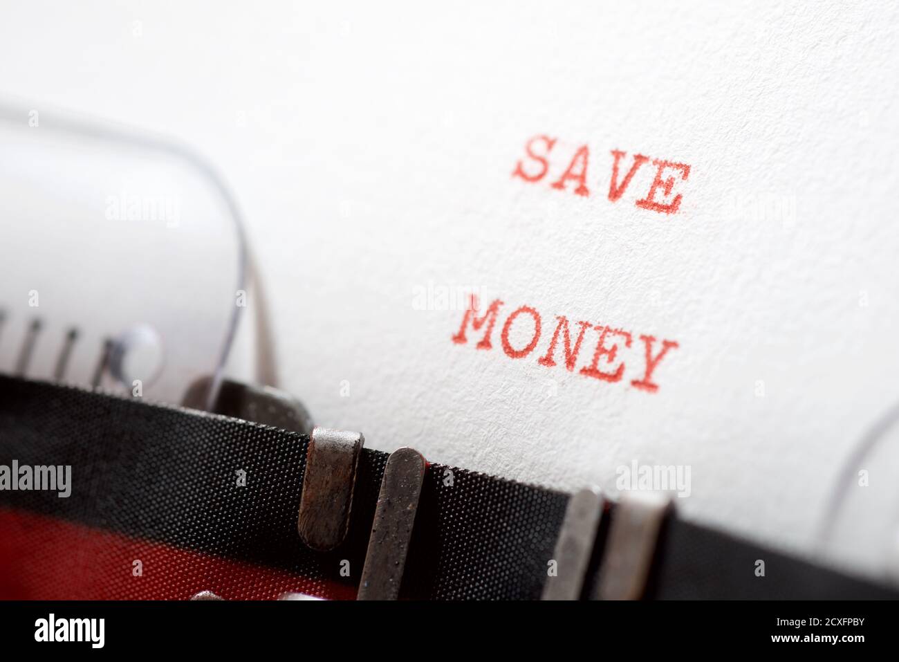 Save money phrase written with a typewriter Stock Photo - Alamy
