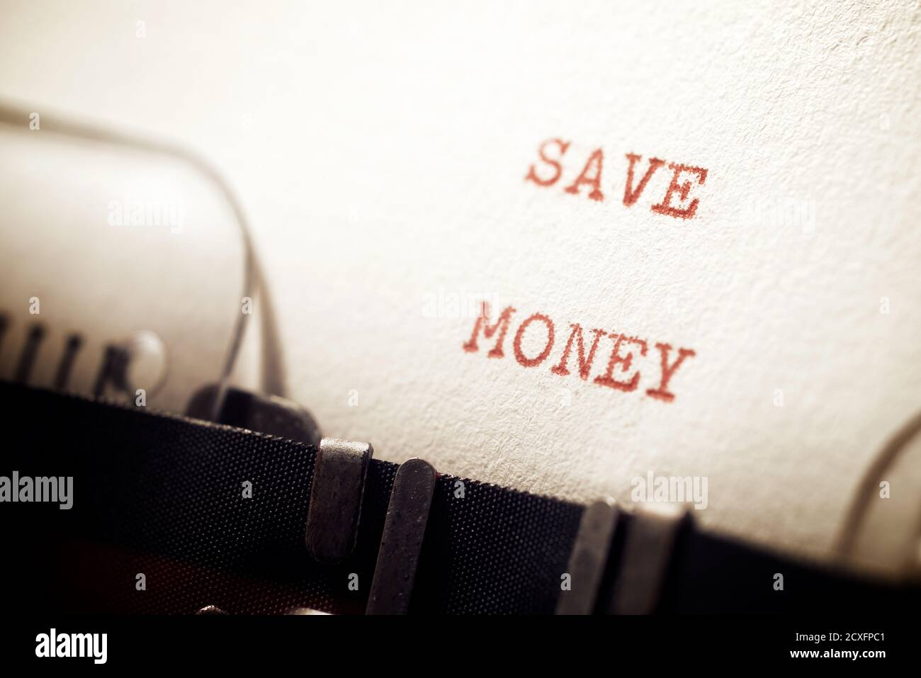 Save money phrase written with a typewriter Stock Photo - Alamy