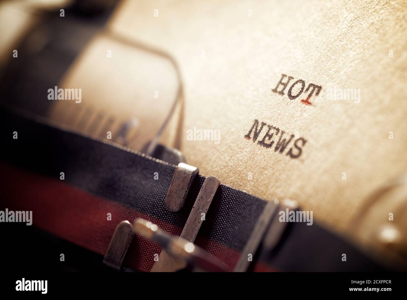 Hot news phrase written with a typewriter Stock Photo - Alamy