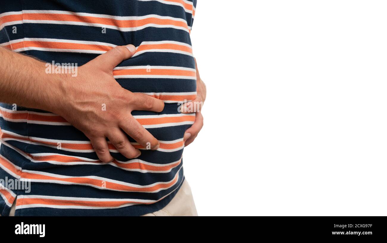 Close-up of man model holding hands on bloated stomach abdomen wearing ...