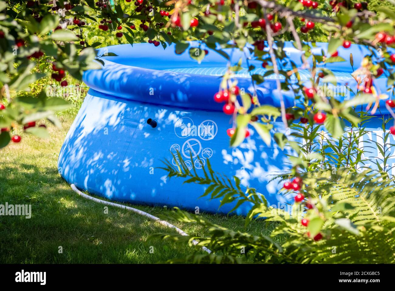 Inflatable blue pool in the backyard of a private house Stock Photo - Alamy