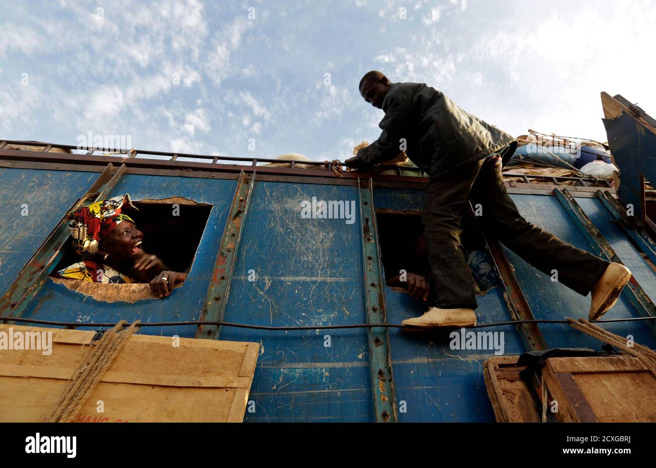 Man Climbing Out Of Window High Resolution Stock Photography and Images ...