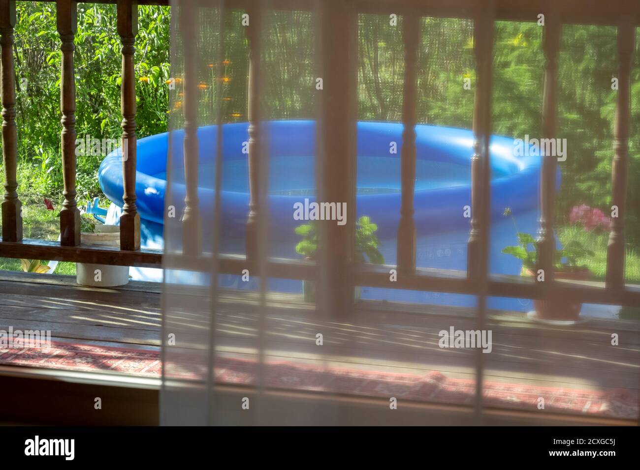 Inflatable blue pool in the backyard of a private house Stock Photo - Alamy