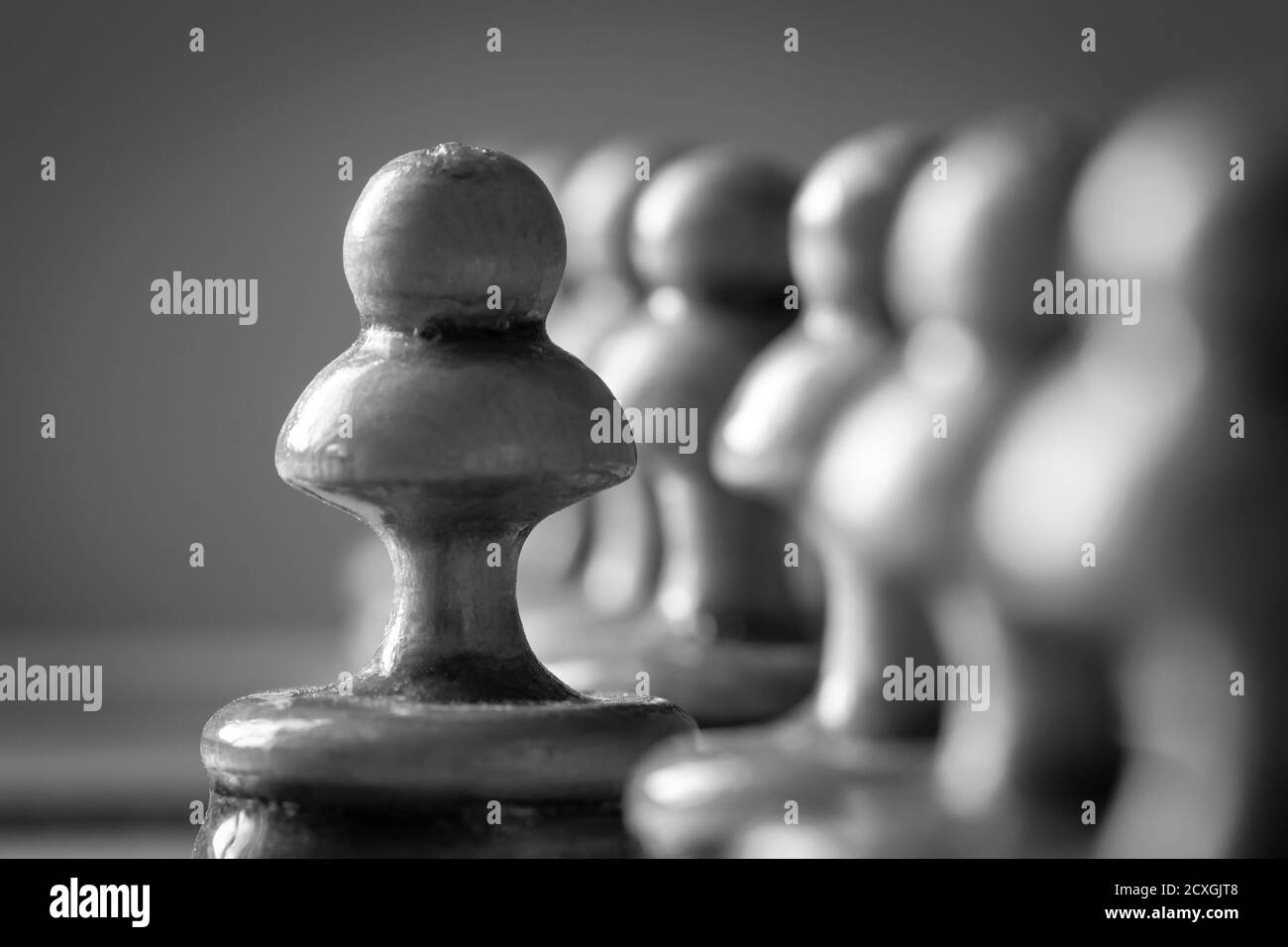 A row of pawns on a chessboard close-up Stock Photo - Alamy