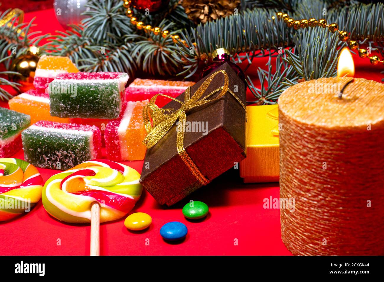 Leneds on a stick and marmalade on a red background with a burning ...
