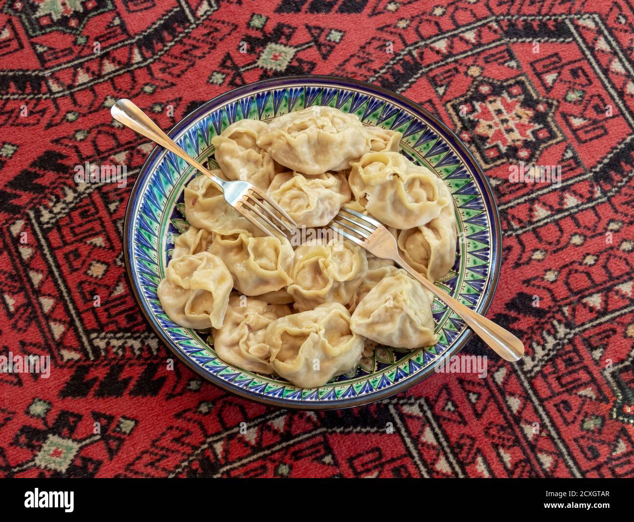 Ready-made manti in a national large plate Stock Photo - Alamy