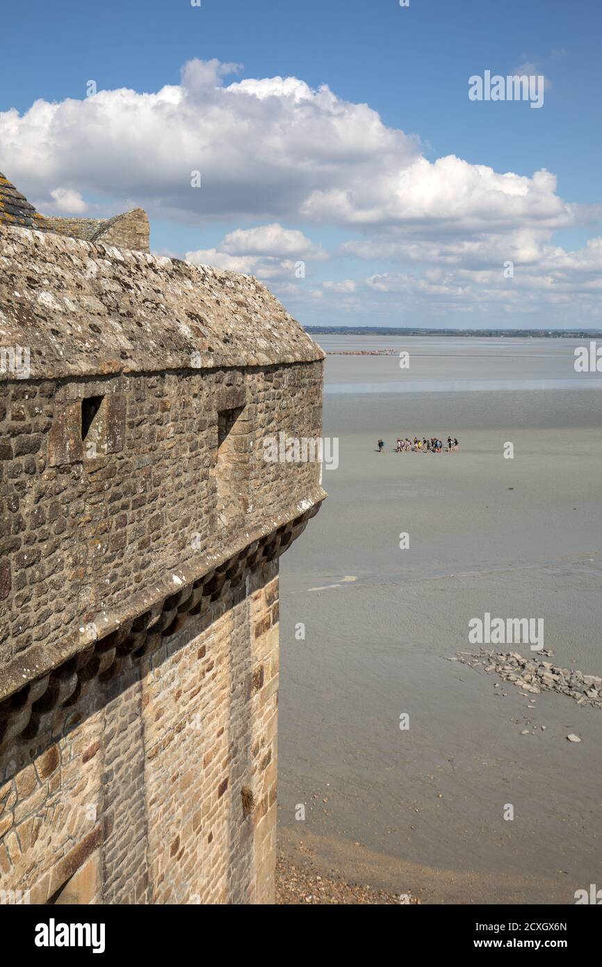 Mont Saint-Michel, the monastery and village on a tidal island between ...