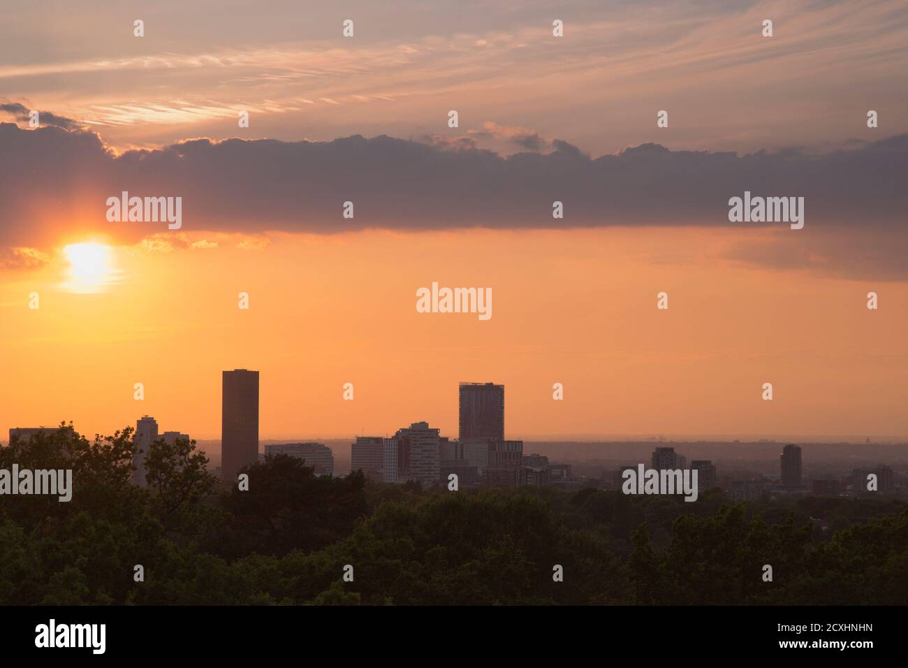 Sun setting behind Croydon skyline south London England Stock Photo - Alamy