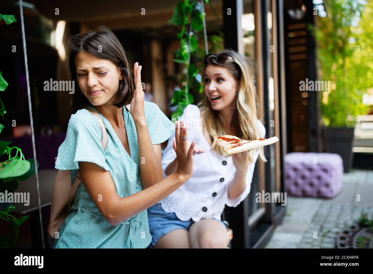 Woman rejecting unhealthy fast food because of gluten intolerance Stock ...