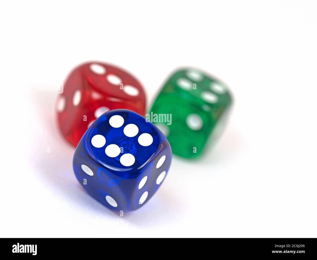 Colorful game dice against white background Stock Photo - Alamy