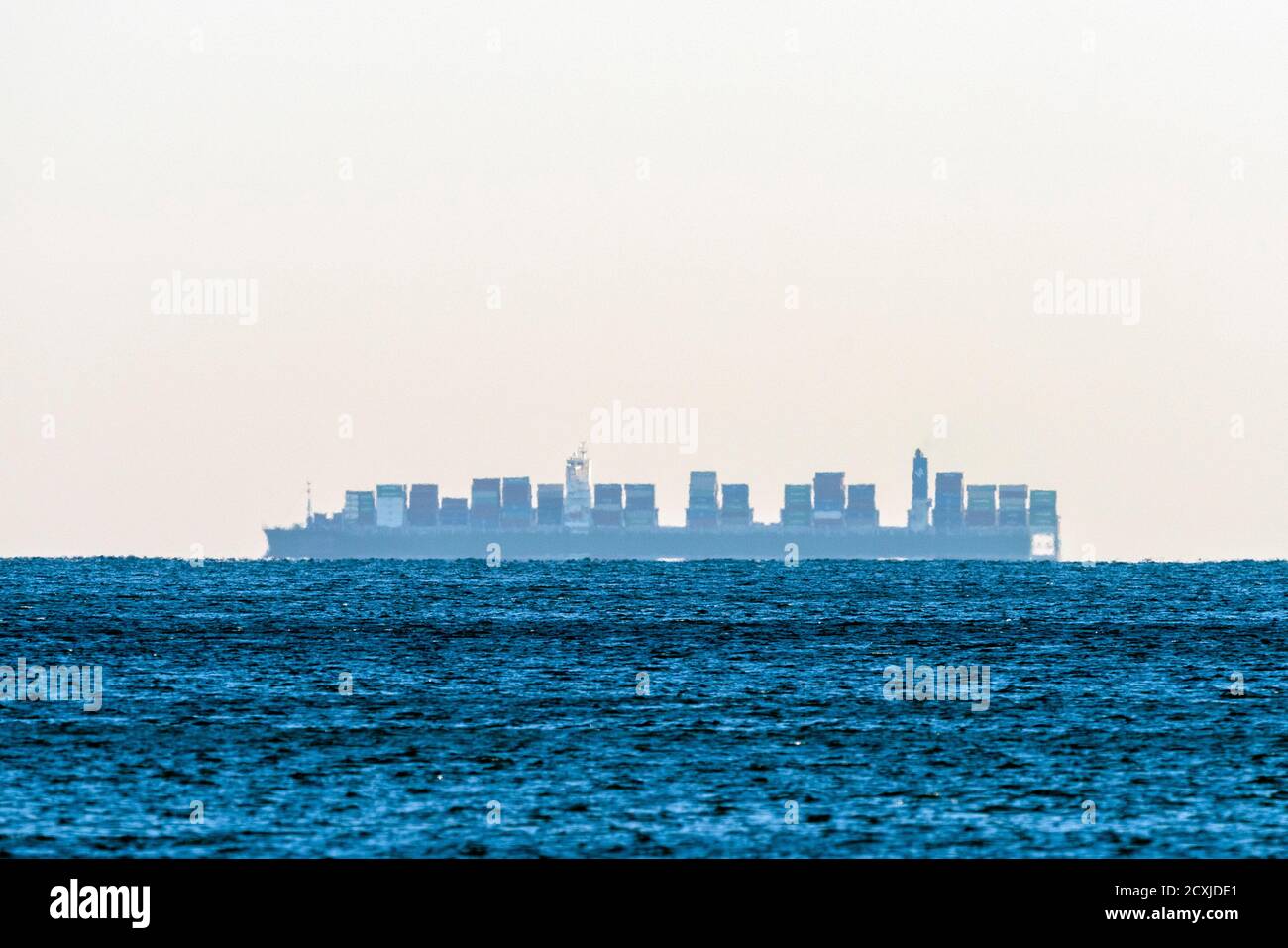Big ship mirage on sea horizon line landscape Stock Photo - Alamy