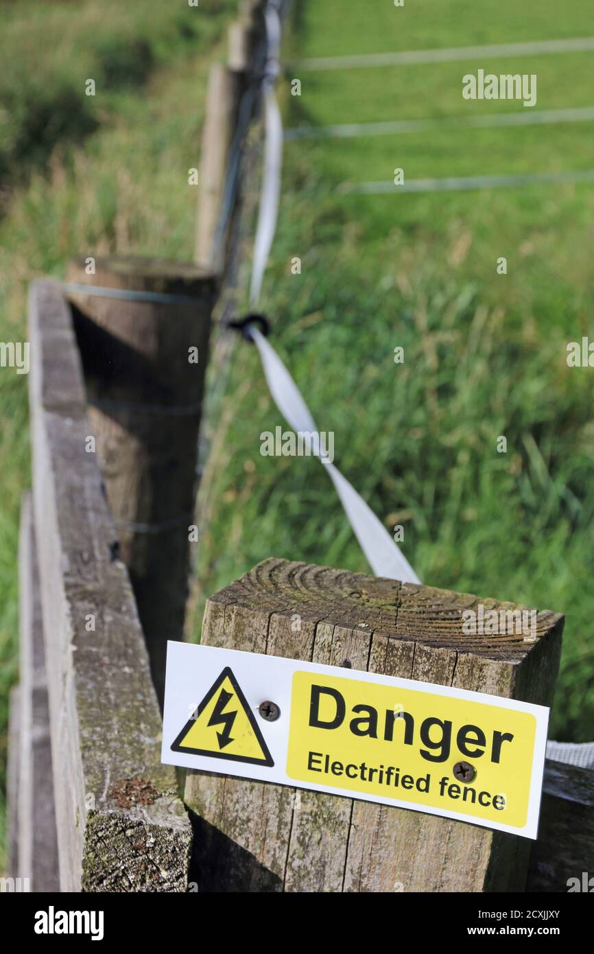Danger, Electrified Fence warning sign Stock Photo - Alamy