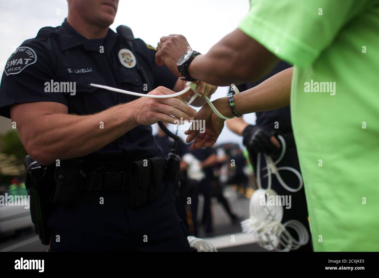 Hand cuffs arrested hi-res stock photography and images - Alamy