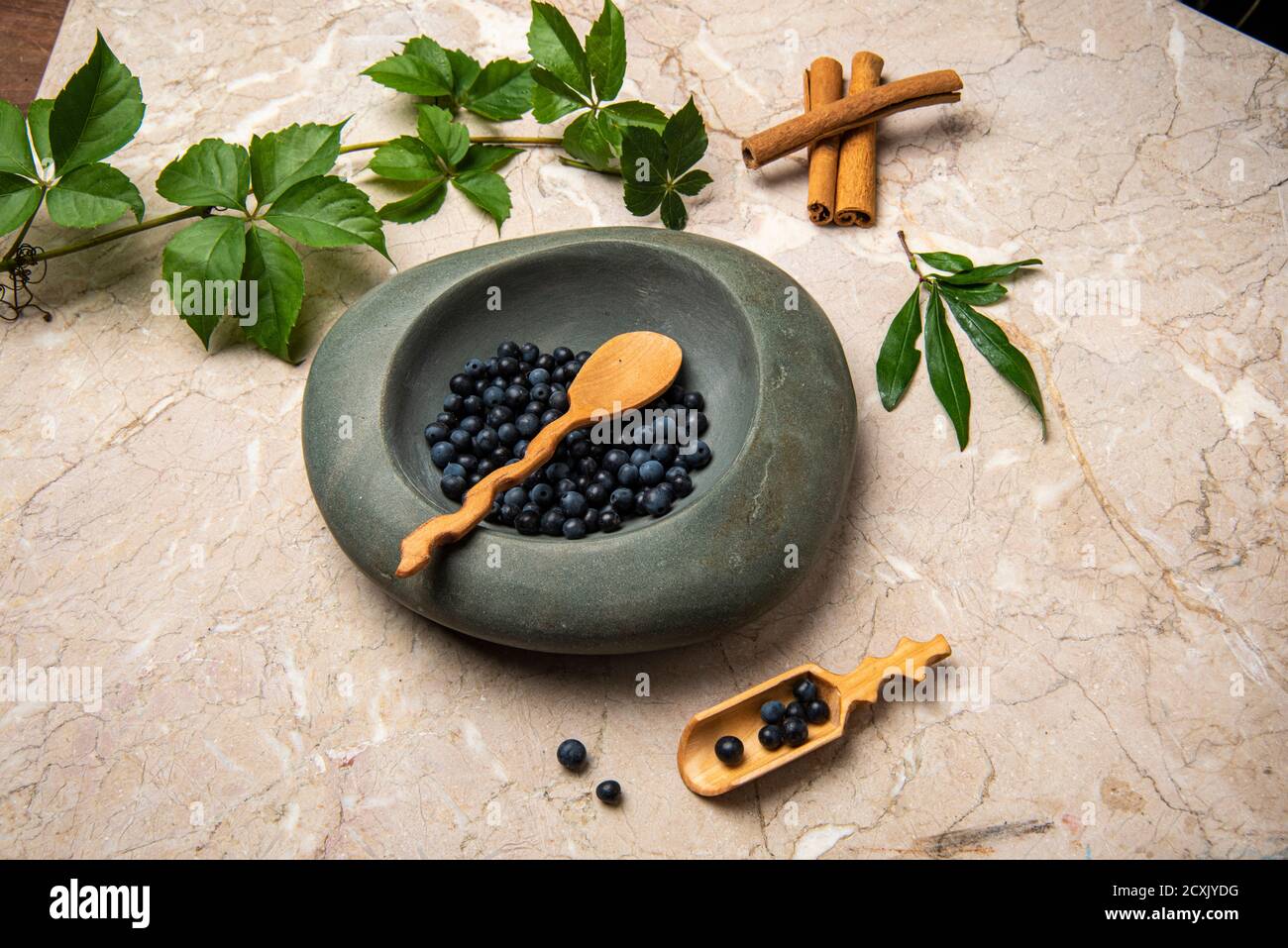 natural stone bowl handcrafted with spices Stock Photo - Alamy