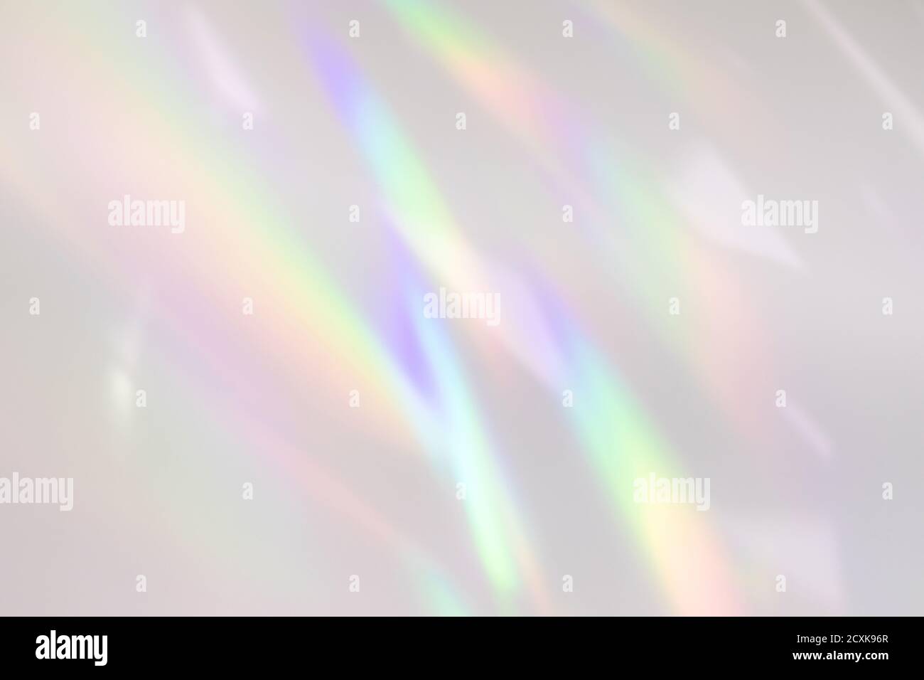 Blurred rainbow light refraction texture on white wall Stock Photo - Alamy