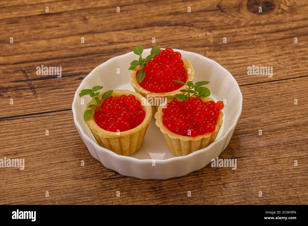 Apetizer - tartlet with red caviar snack Stock Photo - Alamy