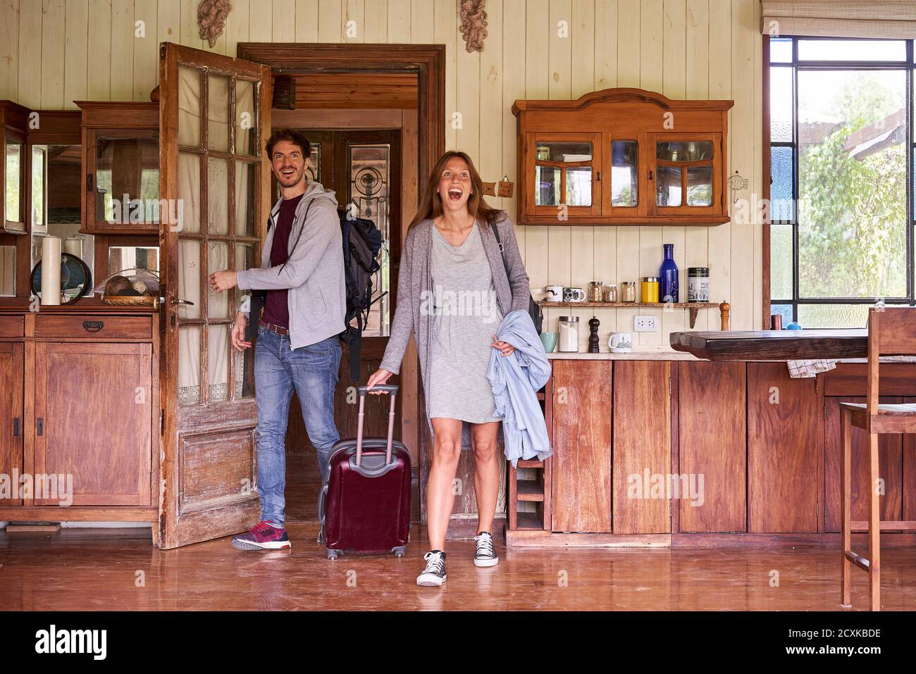 Young couple entering their new house Stock Photo - Alamy